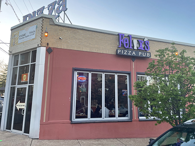 Corner spot, cutting-edge flavor. Felix's salmon-colored wall and purple signage hint at the creative pizza-and-pint pairings waiting inside.