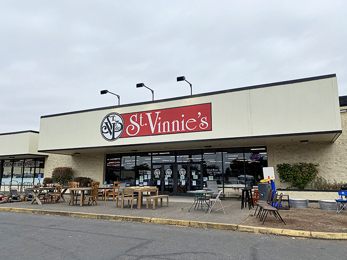 St. Vinnie's red sign beckons like a lighthouse for the bargain-obsessed, promising treasures amid everyday castoffs.