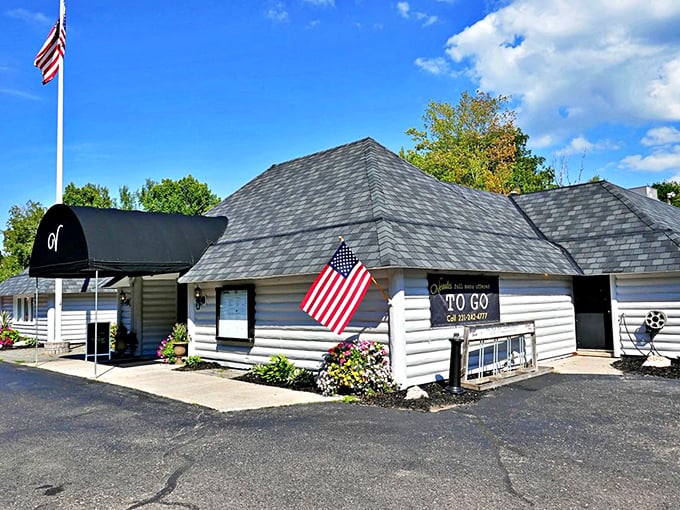 Vernales' log cabin exterior and elegant black awning &ndash; where North Woods charm meets world-class beef expertise.