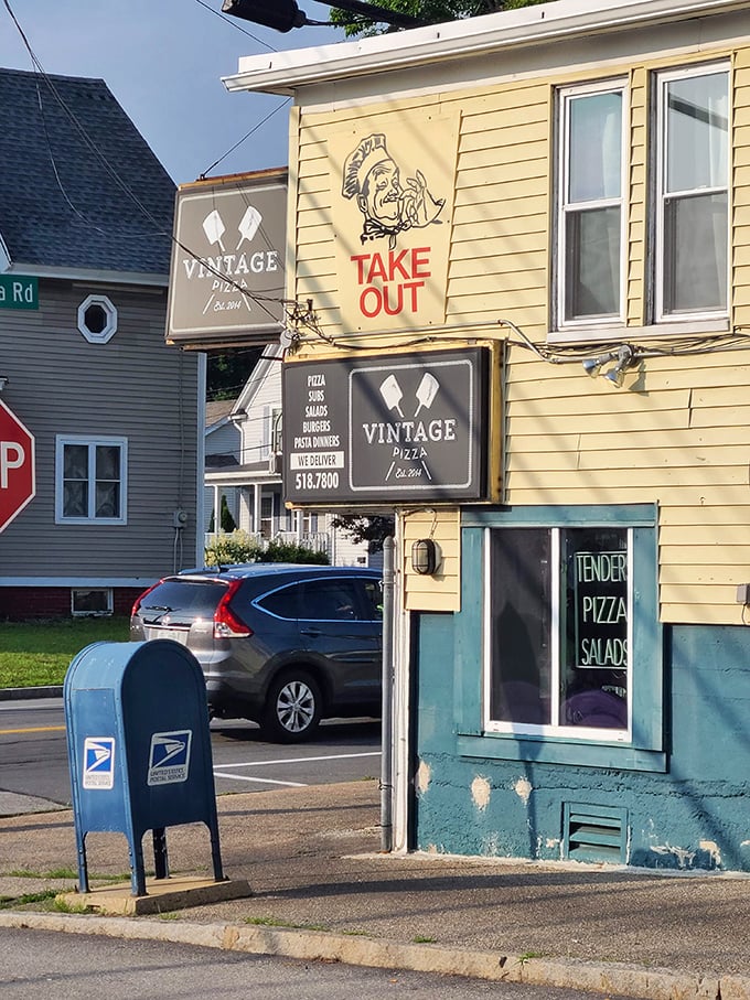 Vintage Pizza's humble yellow exterior is the Clark Kent disguise for the Superman of Manchester's pizza scene.