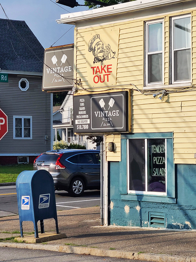 Vintage Pizza's cheerful yellow exterior and cartoon chef promise old-school pizza craftsmanship that puts modern chains to shame.