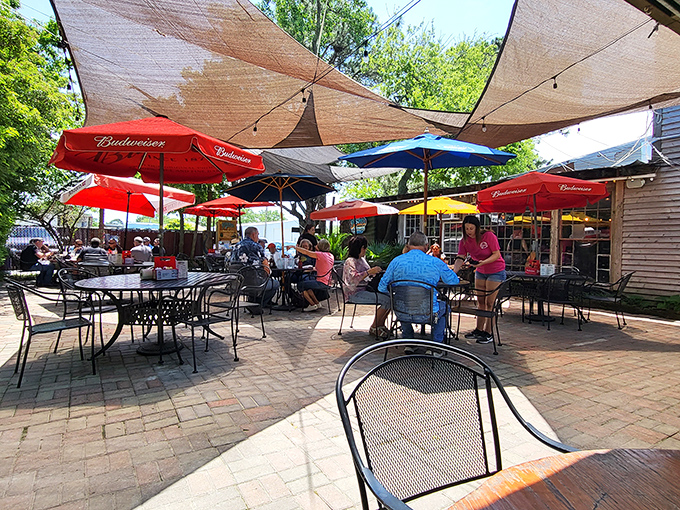 Behind those green doors lies a seafood paradise where the only thing fresher than the oysters is the salty conversation.