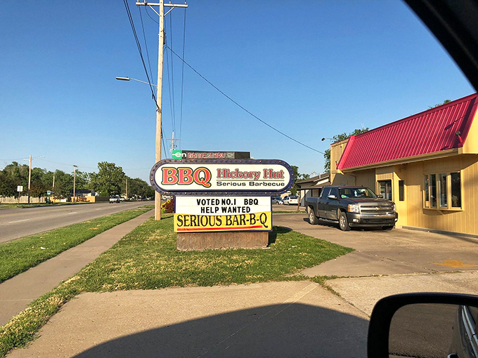 Hickory Hut BBQ: "Yellow building, straightforward sign. No distractions from what matters: meat that's been kissed by smoke for hours."