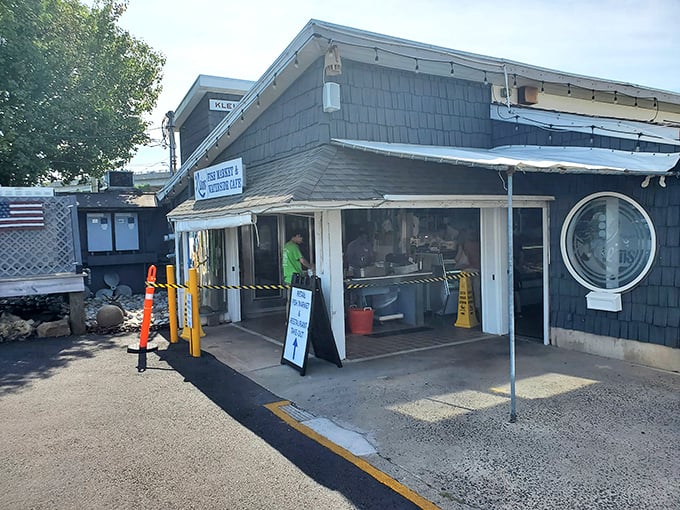 Klein's understated entrance hides waterfront dining where the seafood is fresher than your uncle's retirement jokes.