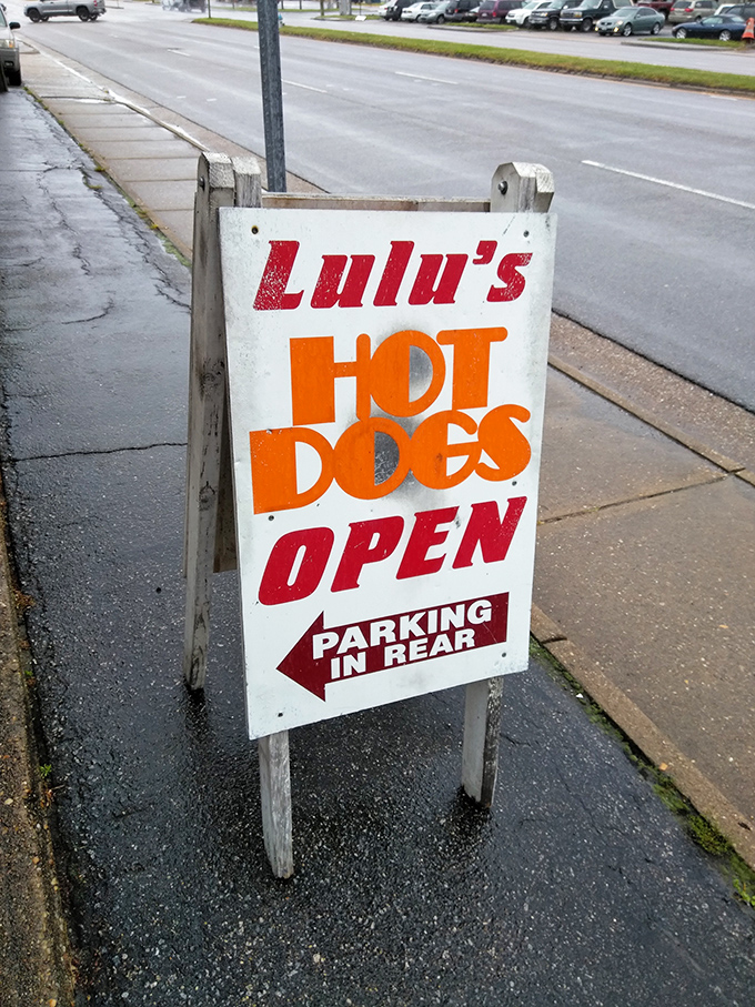 That sidewalk sign isn't just directing you to parking &ndash; it's pointing the way to hot dog enlightenment at Lulu's.