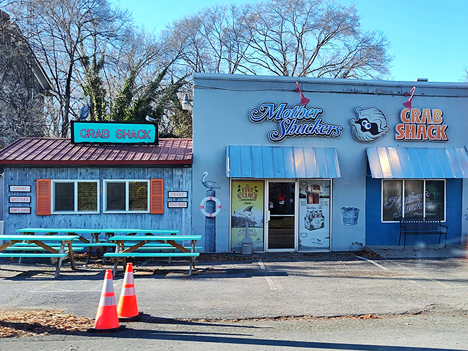 Blue buildings, red crab, and picnic tables outside &ndash; Mother Shuckers nails the "casual crab shack" aesthetic perfectly.