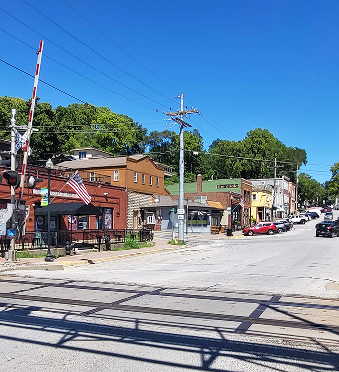 The sun casts long shadows across Parkville's historic district, where every brick seems to hold a century of secrets.