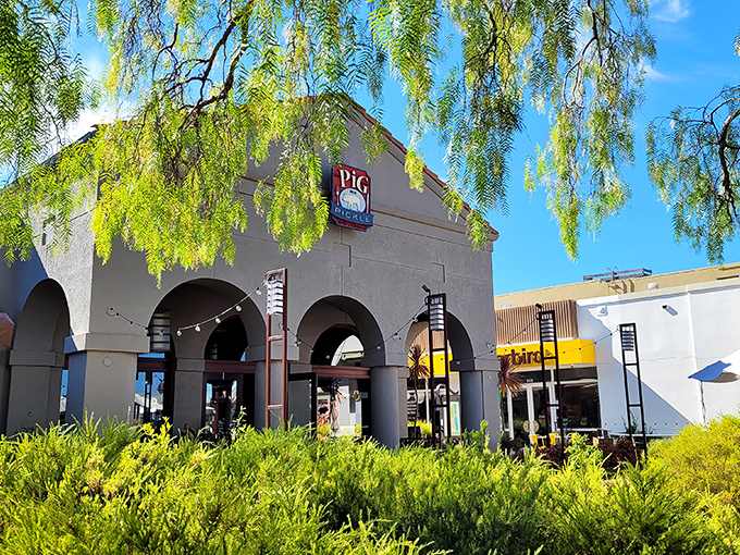 Beneath those graceful arches and swaying trees lies a barbecue joint that balances tradition with California refinement.