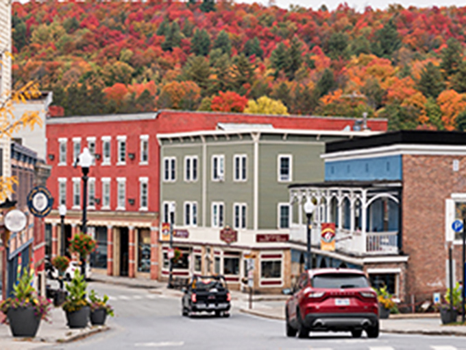 The colorful facades of Saranac Lake shops pop against the Adirondack backdrop like nature's own art gallery.