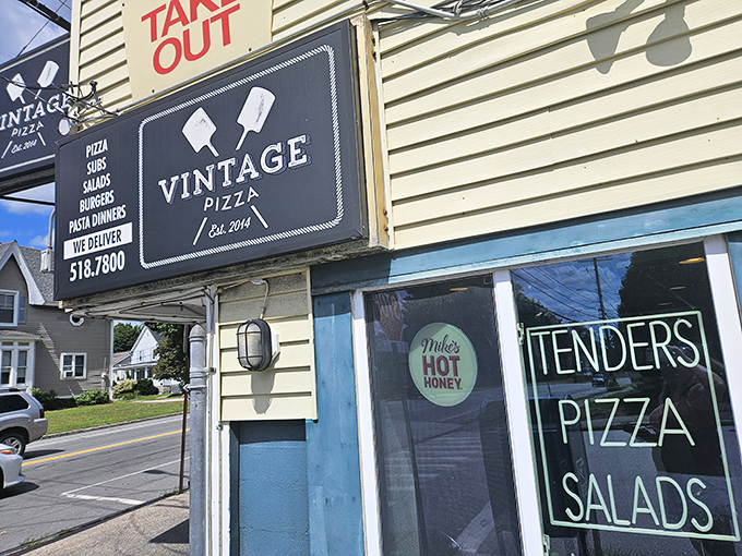 The "TAKE OUT" sign might be the most important road sign in Manchester&mdash;directing pizza pilgrims to Vintage's tender, perfect pies.