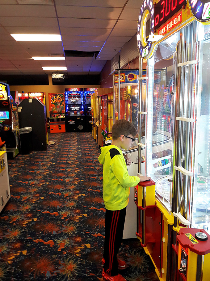 The arcade corridor&mdash;where allowances disappear faster than ice cream in August and kids develop the hand-eye coordination NASA should be recruiting.