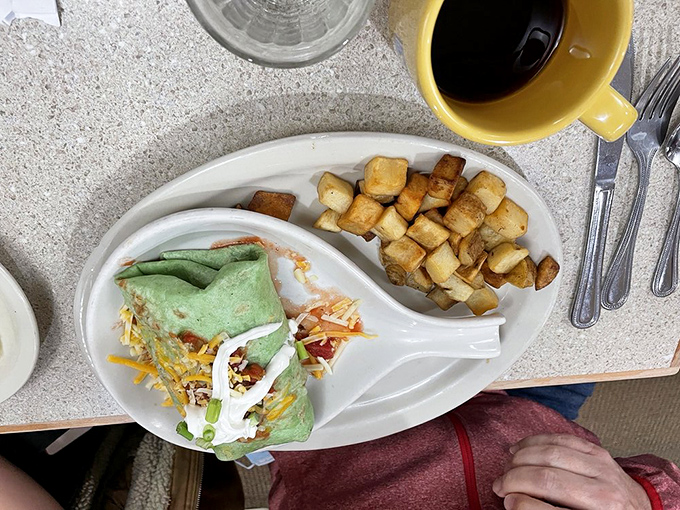 Behold the green-tinged wonder! This spinach tortilla burrito isn't just colorful&mdash;it's practically a vegetable serving wrapped around breakfast bliss.