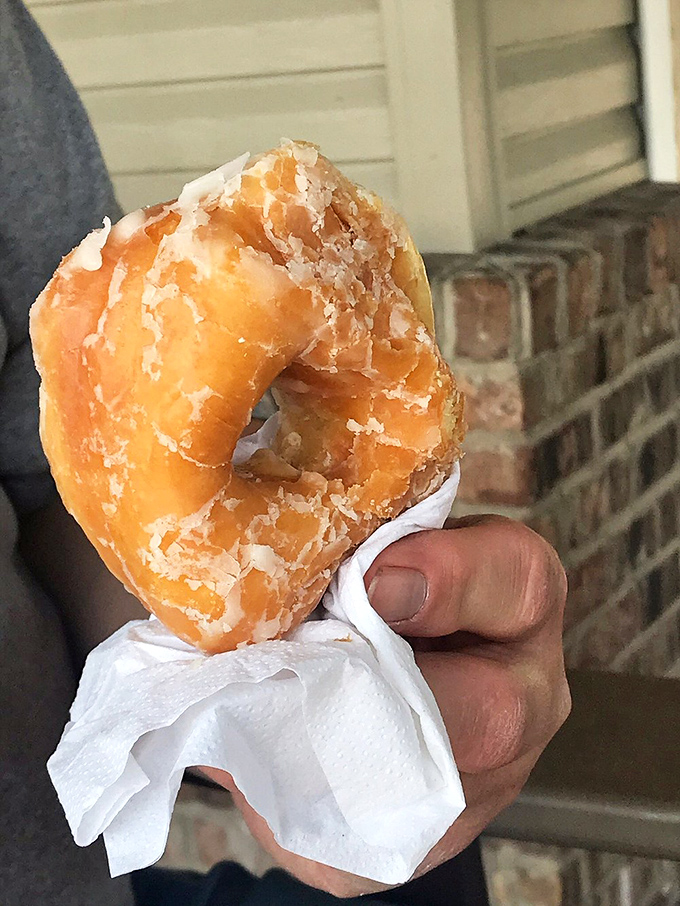 This isn't just breakfast&mdash;it's edible therapy. The glazed donut's golden hue practically radiates warmth like a carbohydrate sunrise.