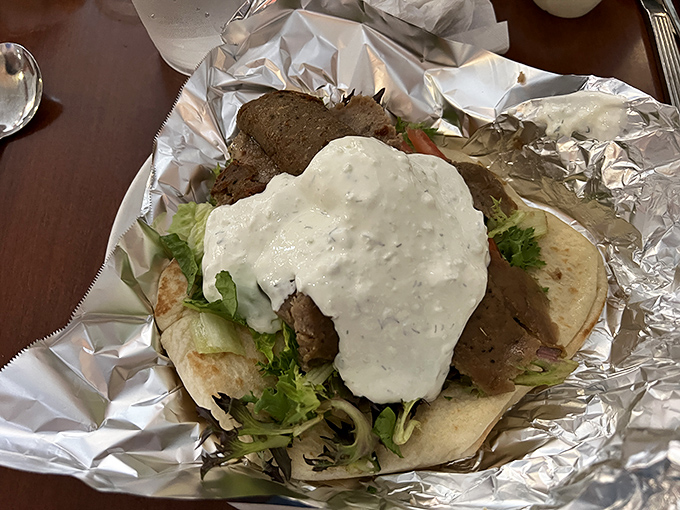 An open-faced gyro that's not being subtle about its intentions to seduce you. That tzatziki is practically winking at you.