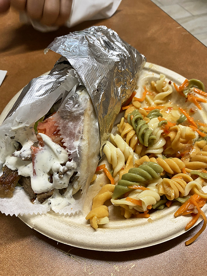 The colorful outfit might catch your eye first, but that gyro platter will dominate your memory long after the meal is finished.