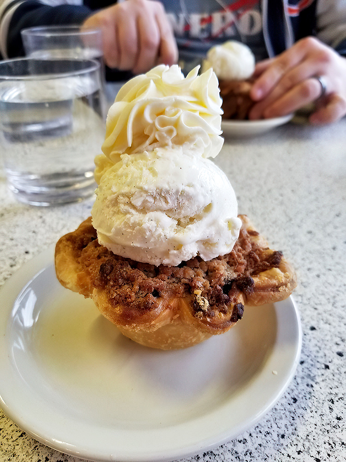 This s'mores pie hole brings campfire nostalgia without the mosquito bites. The perfectly toasted marshmallow top deserves its own round of applause.