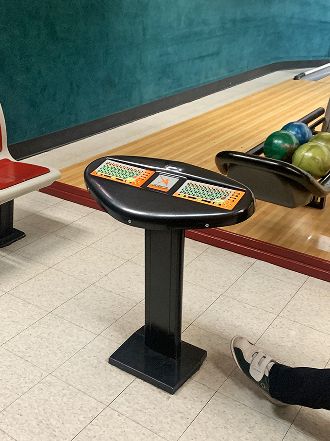 The scoring console &ndash; mission control for your bowling adventure, where friendly competition begins with the press of a button.