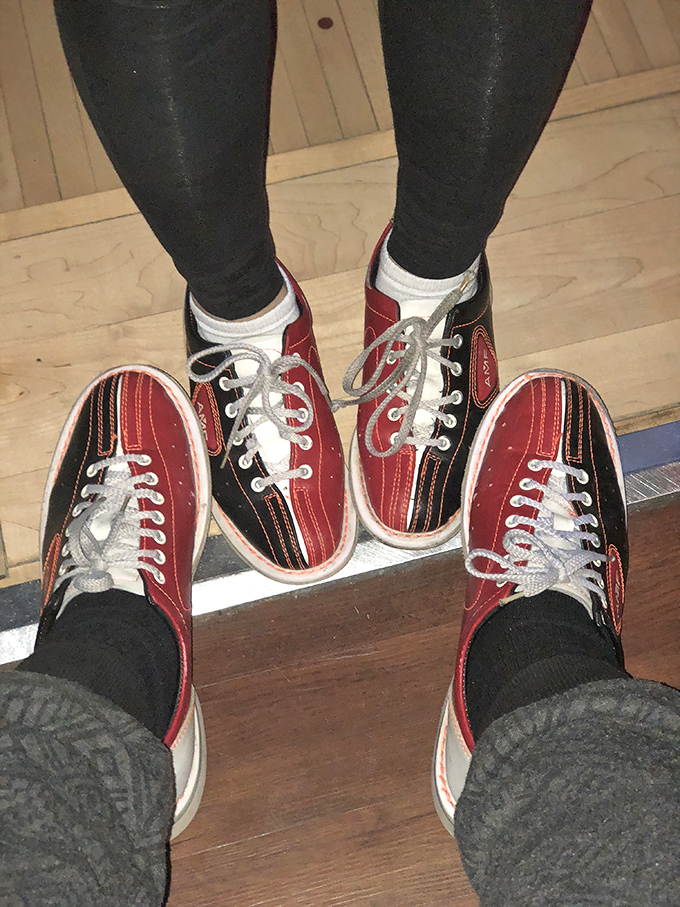 The quintessential bowling experience: those red, black and white rental shoes that somehow make everyone look like they're attending a 1950s sock hop.