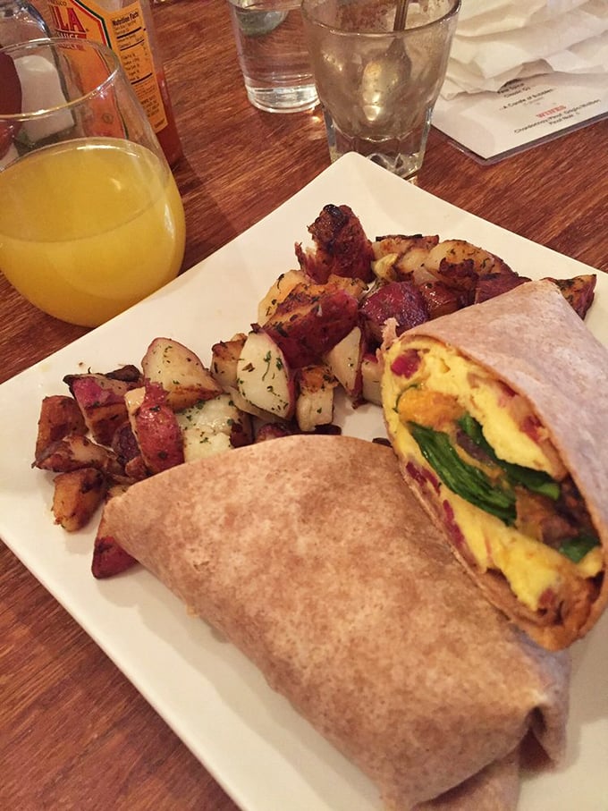 Breakfast architecture at its finest&mdash;layers of egg, beans, and veggies wrapped in a warm tortilla. The side of potatoes seals the deal.