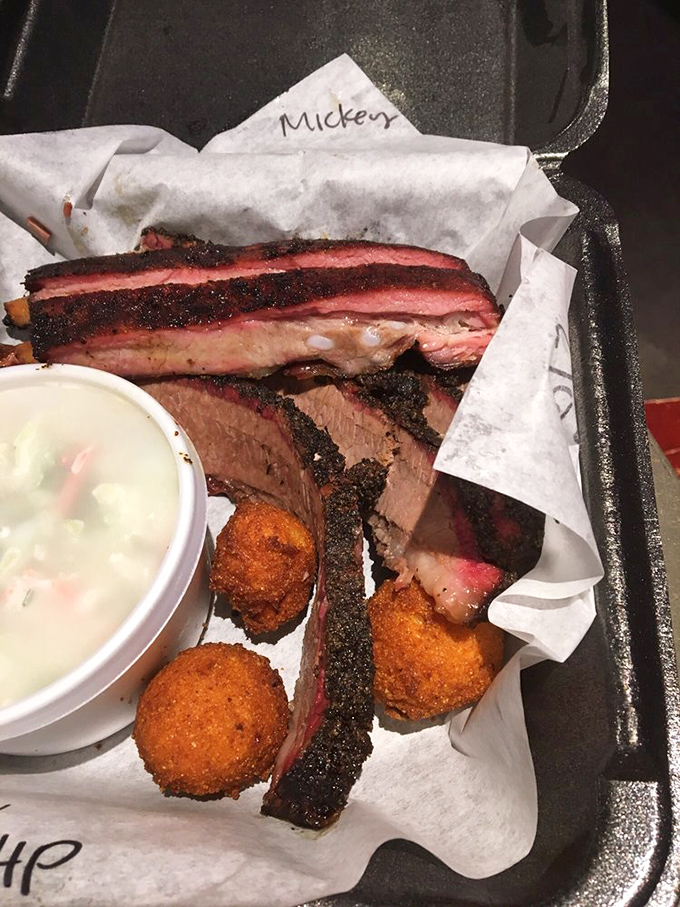 Brisket slices laid out like meaty playing cards, with that hallmark pink smoke ring dealing a winning hand every time.