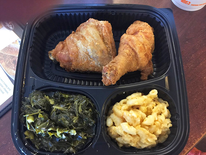 The holy trinity of Southern comfort: fried chicken, collard greens, and mac and cheese. Therapy you can eat with a fork.