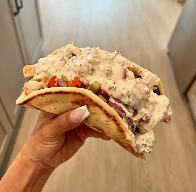 This gyro isn't just food&mdash;it's architecture, sculpture, and pure joy wrapped in a warm, pillowy pita embrace.