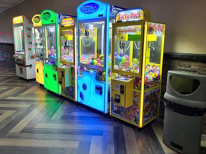 The arcade's claw machines stand like colorful sentinels of hope and disappointment&mdash;promising prizes while teaching life's toughest lessons about persistence.