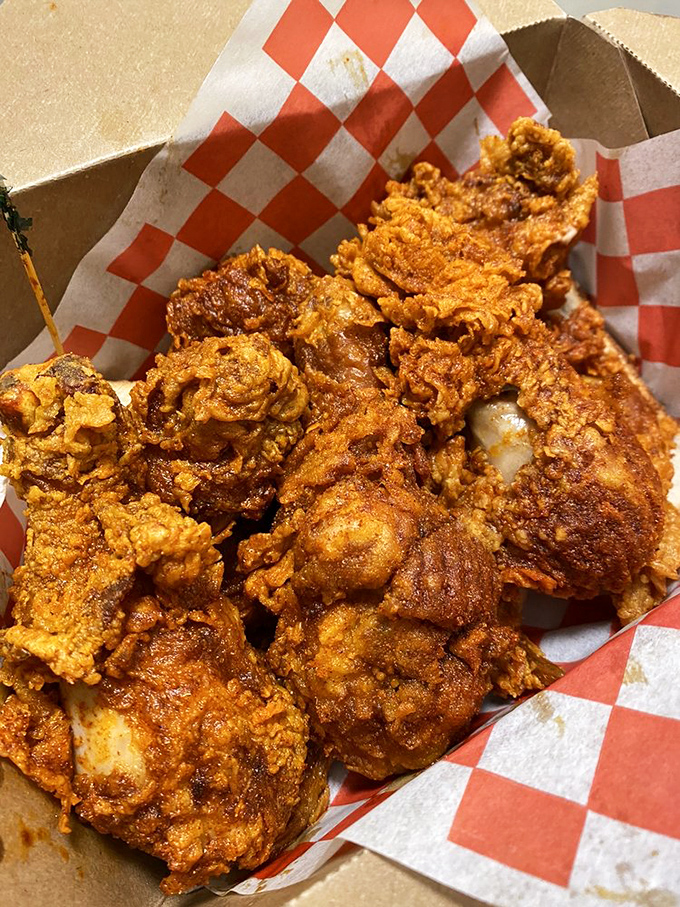 Crispy chicken perfection in its natural habitat&mdash;a red-checkered paper-lined basket that says, "Yes, this will be messy, and yes, it will be worth it."