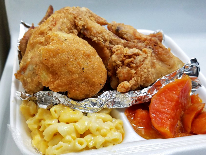 A symphony of comfort on a styrofoam stage&mdash;golden chicken, sunshine-yellow mac and cheese, and sweet carrots that taste like childhood memories.