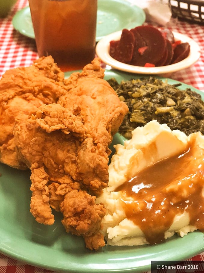This isn't just a meal; it's edible Southern poetry with crispy chicken playing the starring role in a three-act comfort food drama.