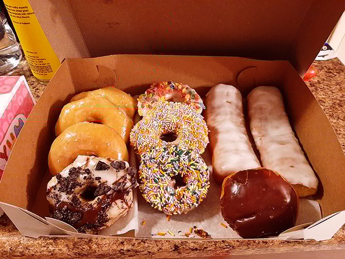 The Old Town Donuts logo proudly displayed on a box of their freshest offerings. Even their packaging whispers, "Open me now."
