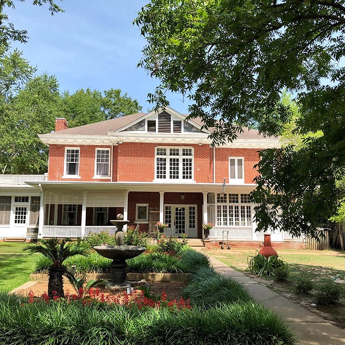 The Grace Estate stands as living proof that brick, symmetry, and a proper front porch fountain are the holy trinity of Southern architecture.