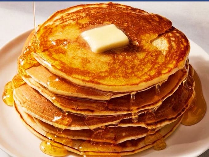 Pancake stacks taller than Florida's humidity, with butter melting like snowbirds in January. Worth every delicious calorie.