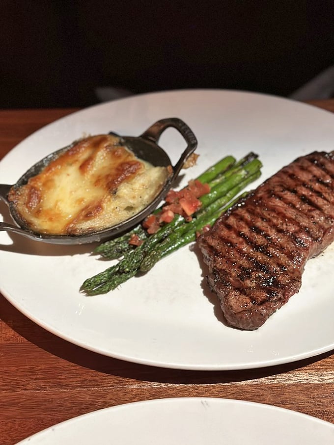 This plate has everything: protein, vegetables, and a loaded potato that's dressed better than I am for most weddings.