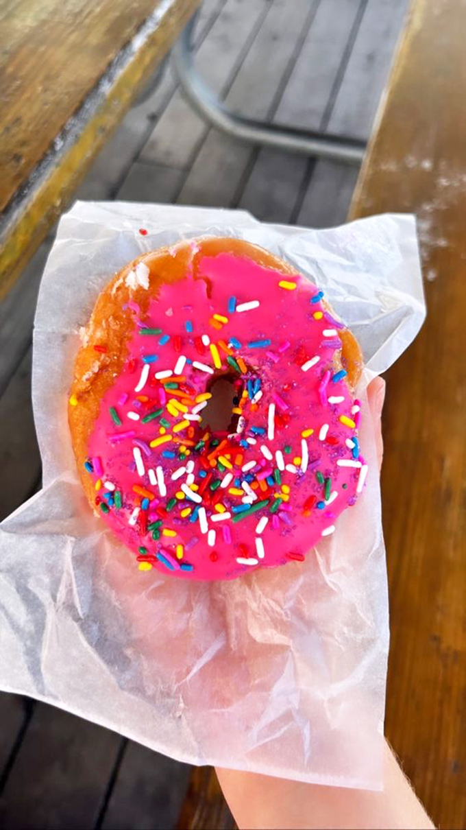 This pink masterpiece isn't just a donut&mdash;it's a mood-altering device. Sprinkles are nature's antidepressant.