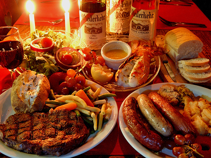 A feast fit for royalty&mdash;candlelight, wine bottles standing at attention, and enough food to make your cardiologist wince with concern.