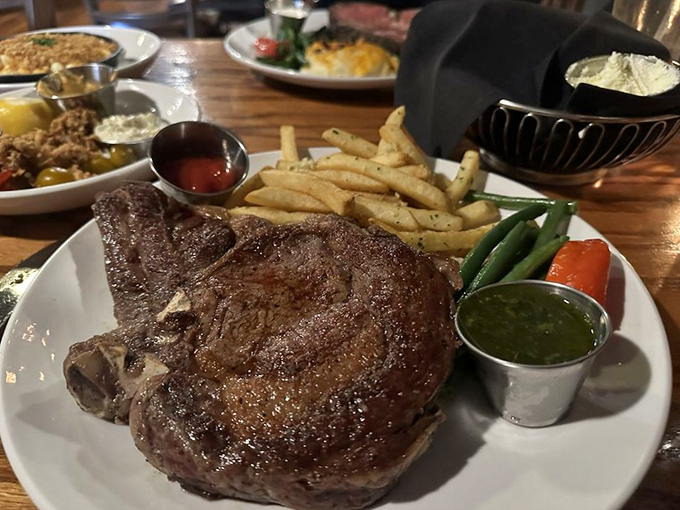 When a steak comes with its own handle, you know you're in for serious business. This bone-in ribeye demands respect and rewards patience.