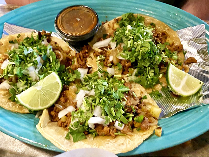 These tacos don't need Instagram filters – the lime wedges, fresh cilantro, and perfectly charred meat create their own visual poetry.