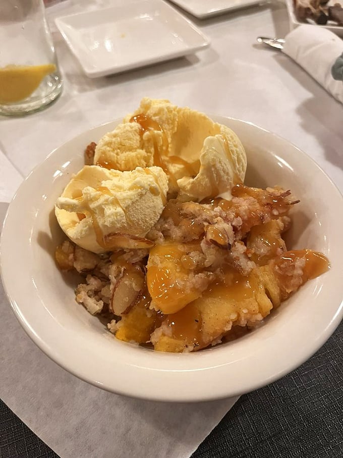 Fruit crisp that makes you question why anyone bothers with fancy desserts. Vanilla ice cream melting into warm peachy perfection.
