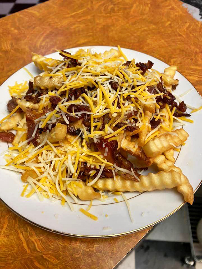 French fries wearing a cheese and bacon tuxedo. Knife and fork required, but stretchy pants highly recommended.