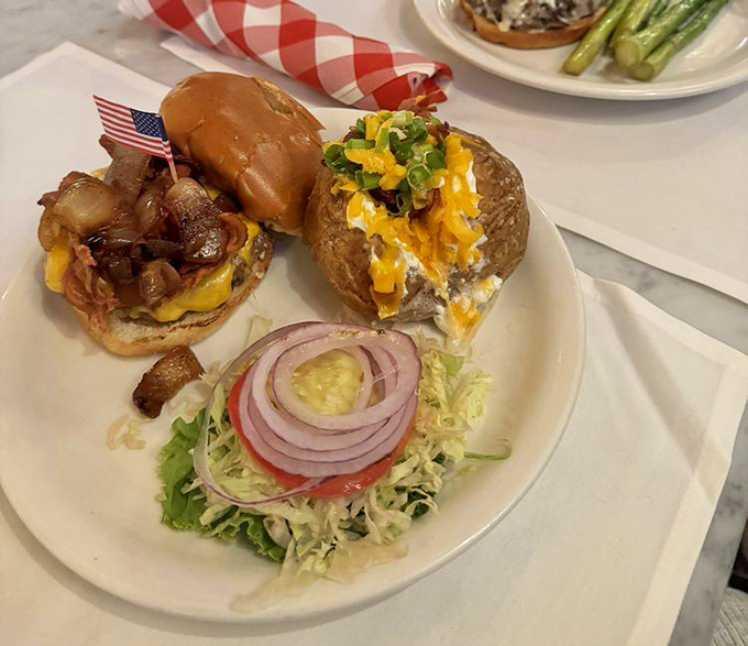Not just a burger but a towering achievement of beef, cheese, and caramelized onions that requires both hands and possibly a strategy session.