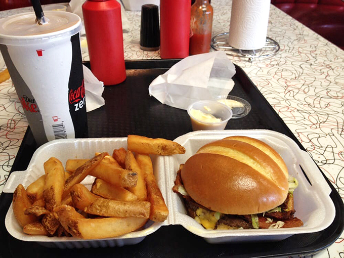 The humble cheeseburger, elevated to art form. Cheese cascades down the patty like a yellow waterfall of happiness.