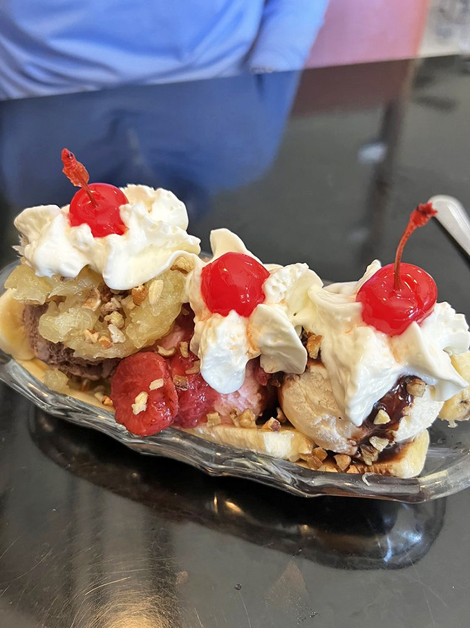 Ice cream architecture at its finest! This banana split is the skyscraper of desserts&mdash;layers of flavor crowned with cherries that demand to be photographed before devoured.