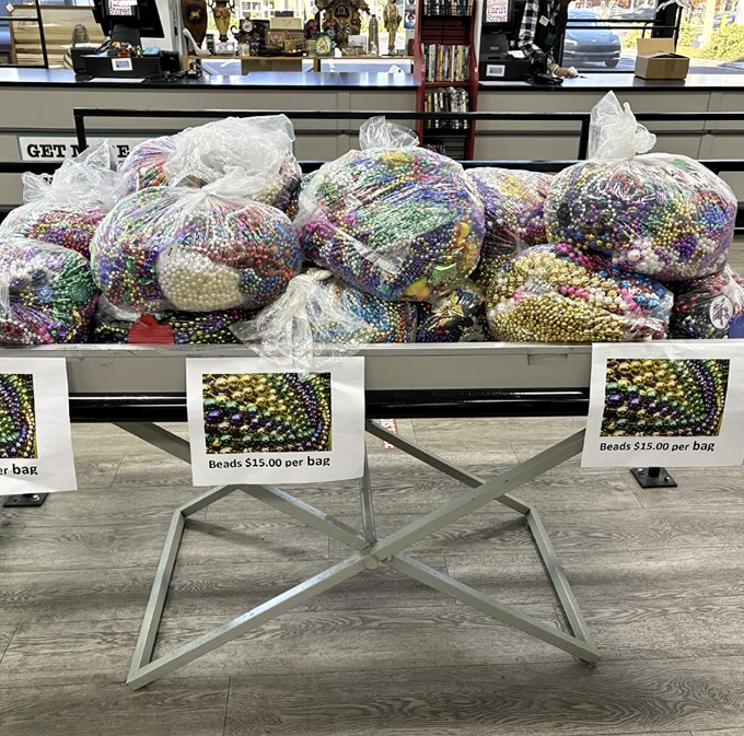 Mardi Gras exploded and landed right on this table. Each bag of beads contains someone's former celebration, now awaiting your creative repurposing or next costume party.