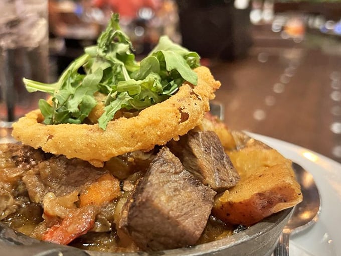 Not your average beef stew&mdash;this hearty masterpiece topped with a crispy onion ring is Southern comfort in a cast-iron vessel.