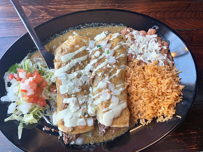 These enchiladas aren't just covered in sauce&mdash;they're swimming in flavor. The rice isn't playing backup; it's a co-star in this delicious production.