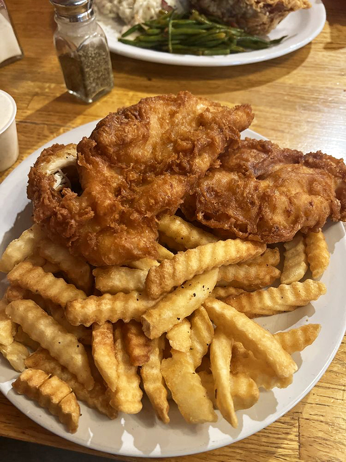 These aren't just chicken strips&mdash;they're golden-armored flavor vessels escorted by a royal guard of perfectly crisp crinkle-cut fries.