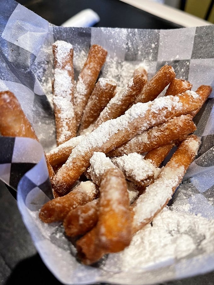These beignets aren't just dusted with powdered sugar&mdash;they're wearing winter coats of it. New Orleans tradition meets South Carolina appetite in every bite.