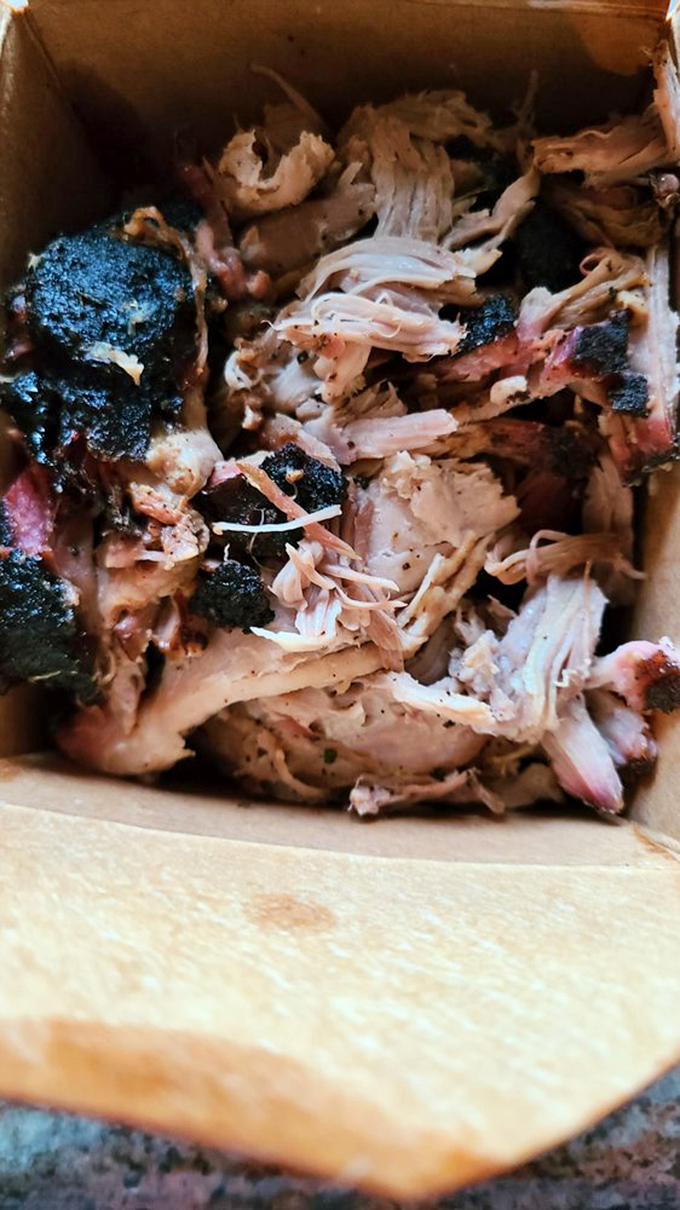 Pulled pork with character&mdash;each strand telling its own smoky story. The blackened bits are like flavor exclamation points!