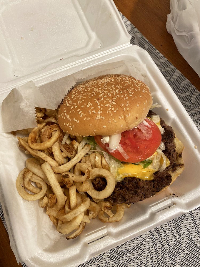 When melted cheese cascades over the patty's edges like a yellow waterfall, you know you're in for something special.